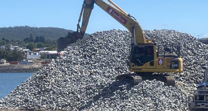 Giant cranes, trucks and long reach excavators