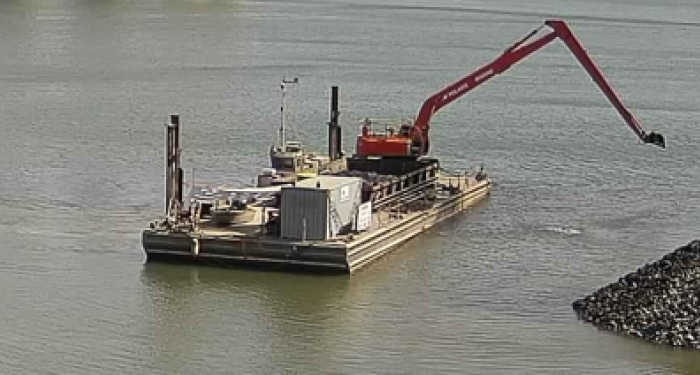 Giant cranes, trucks and long reach excavators